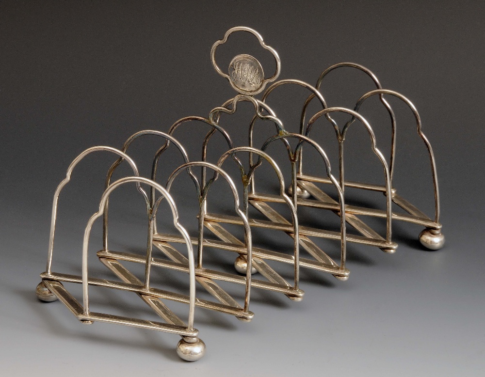 A Georgian silver telescopic six slice toast rack, plain round wire ...