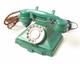 A vintage green bakelite telephone