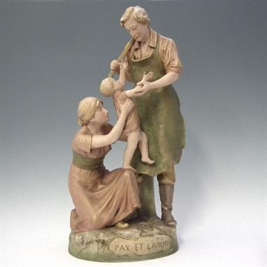 Royal Dux figure group titled Pax Et Labor the figures modelled as a ...