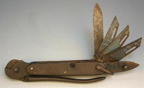 A scarce OSS/SOE combination escape knife of all steel construction ...