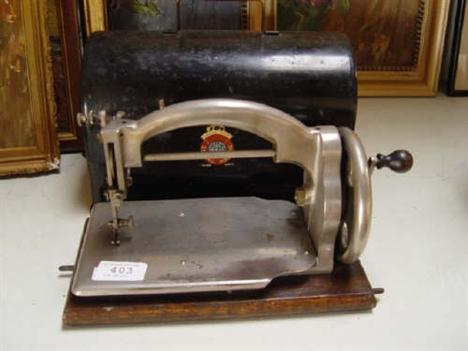 A small vintage portable IDEAL sewing machine Pat. 30264.