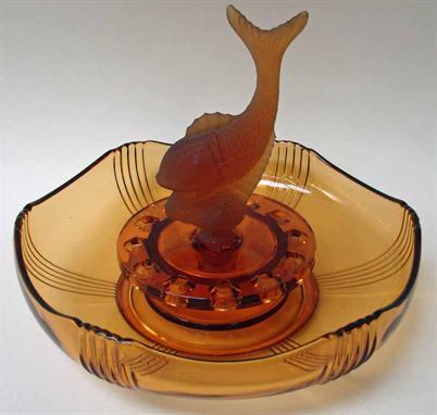An Art Deco, amber glass, fish, flower frog and float bowl, 29cm diameter