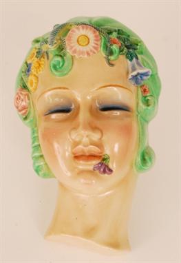 A large Lenci pottery wall mask designed by Camillo Ghigo modelled as a ...